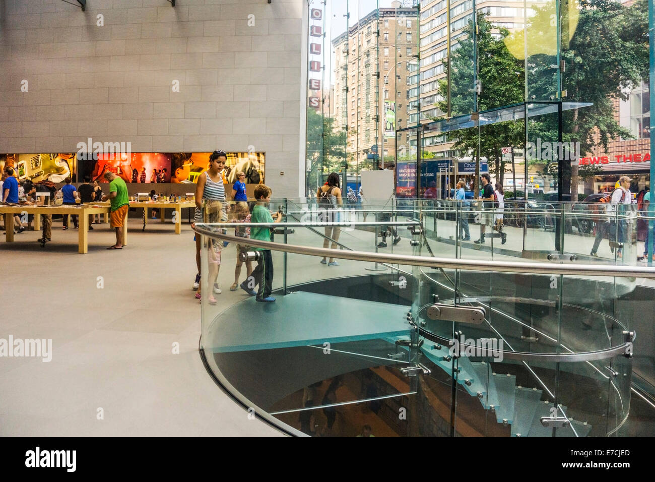 view across Apple store interior to Broadway entrance with customers ...