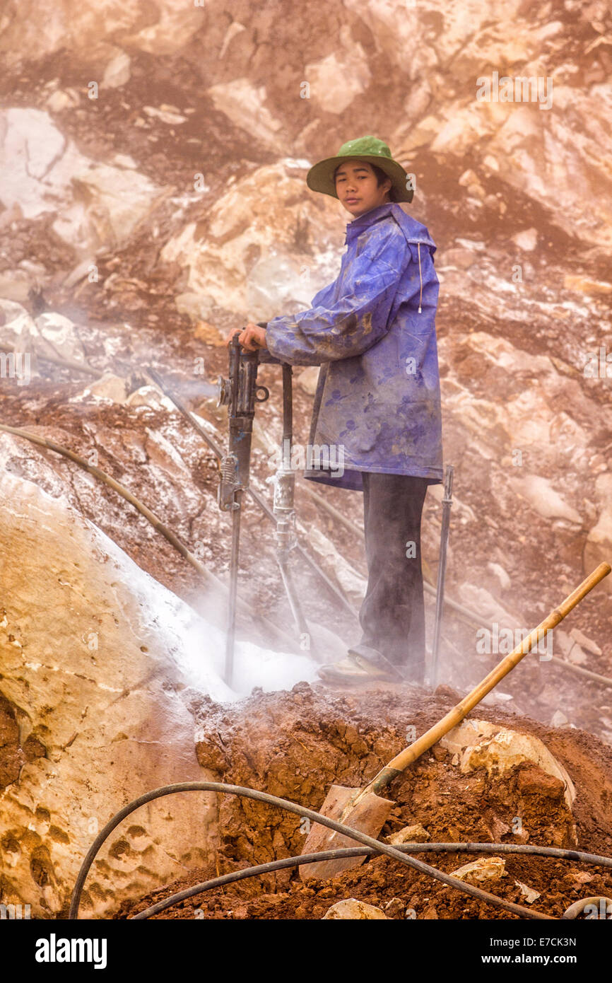 Construction worker drilling in road hi-res stock photography and ...