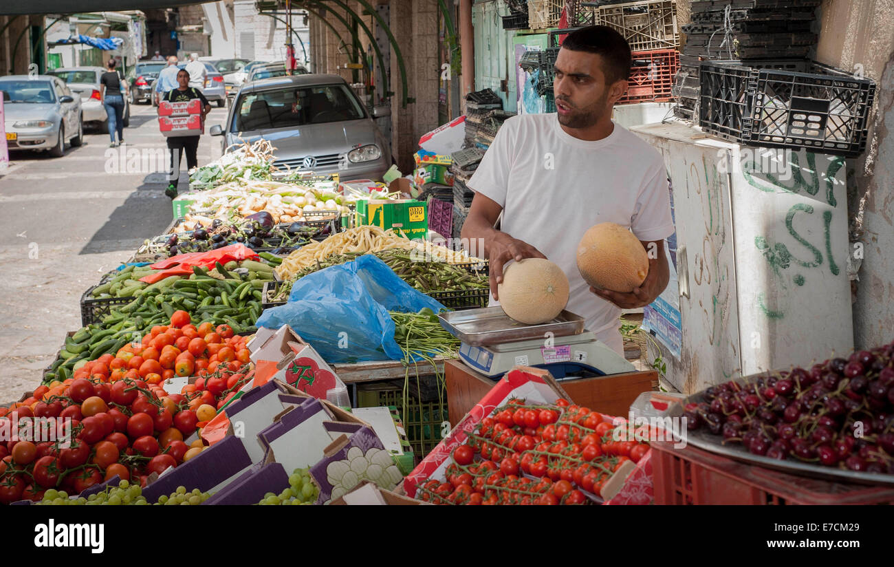 A vegetables vendor at his stand, old market in the old city of ...