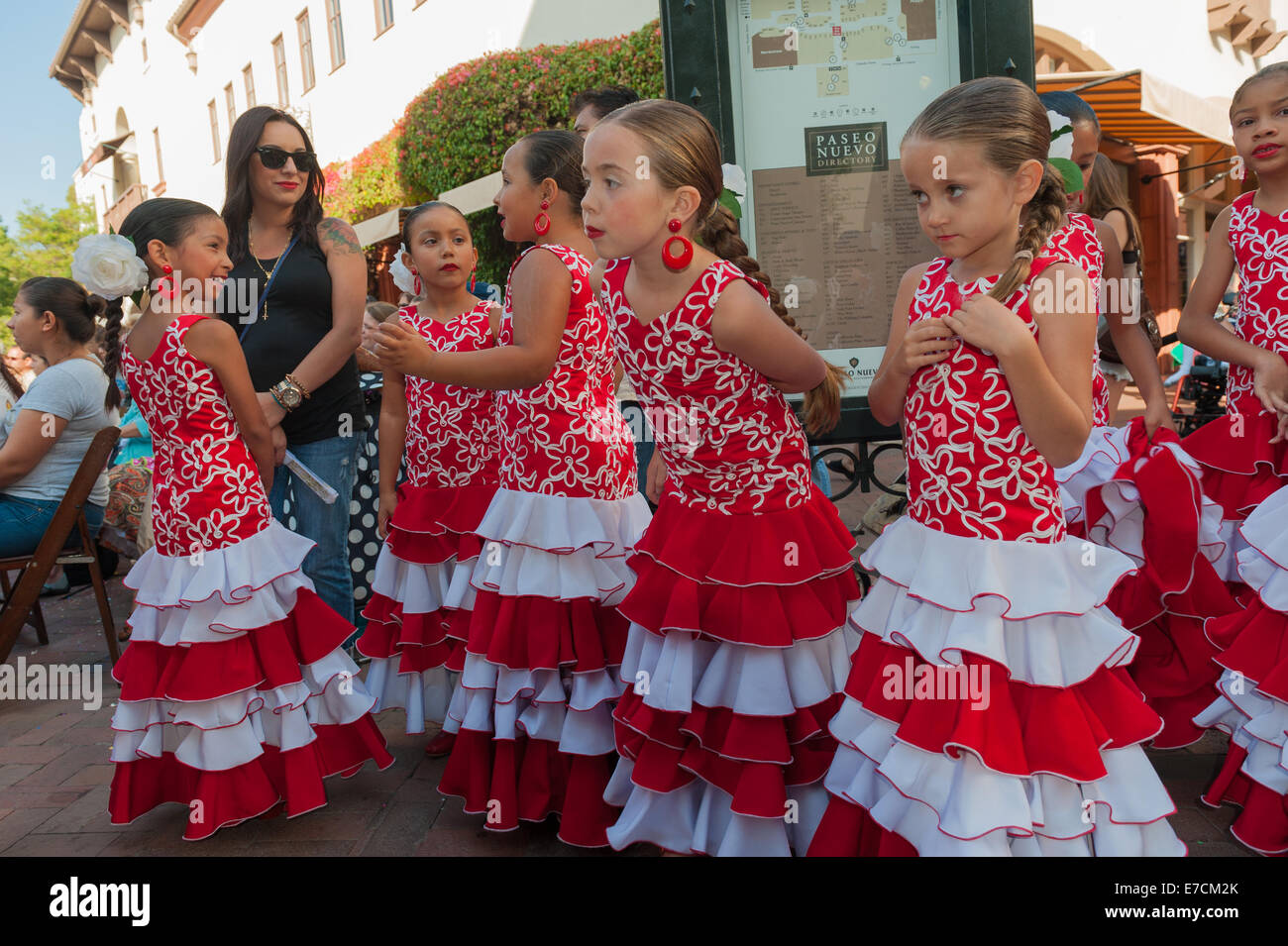 A group of young girls waiting their turn to dance in front an audience ...