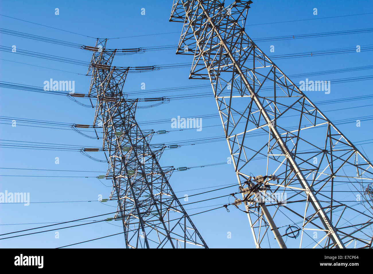 Power lines with blue sky Stock Photo - Alamy