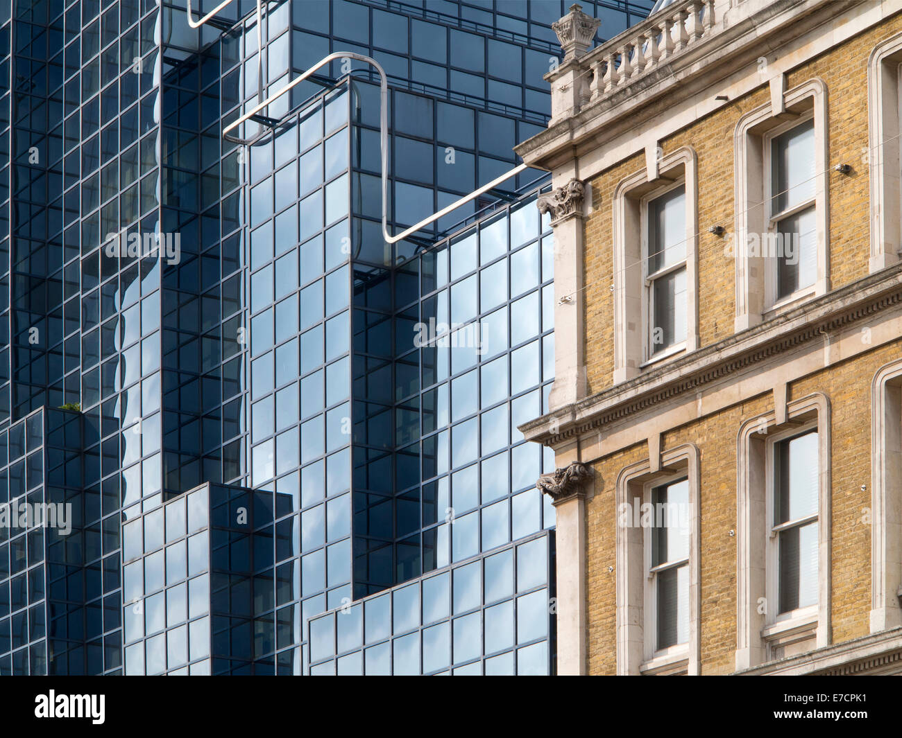 High tech modern office adjacent to traditional yellow brick building ...