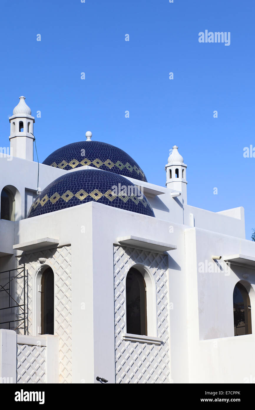White building with blue domes on the corner of the streets Reina ...