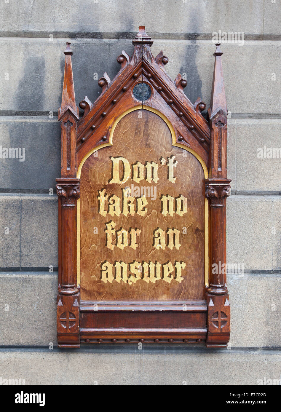 Decorative wooden sign hanging on a concrete wall - Don't take no for ...
