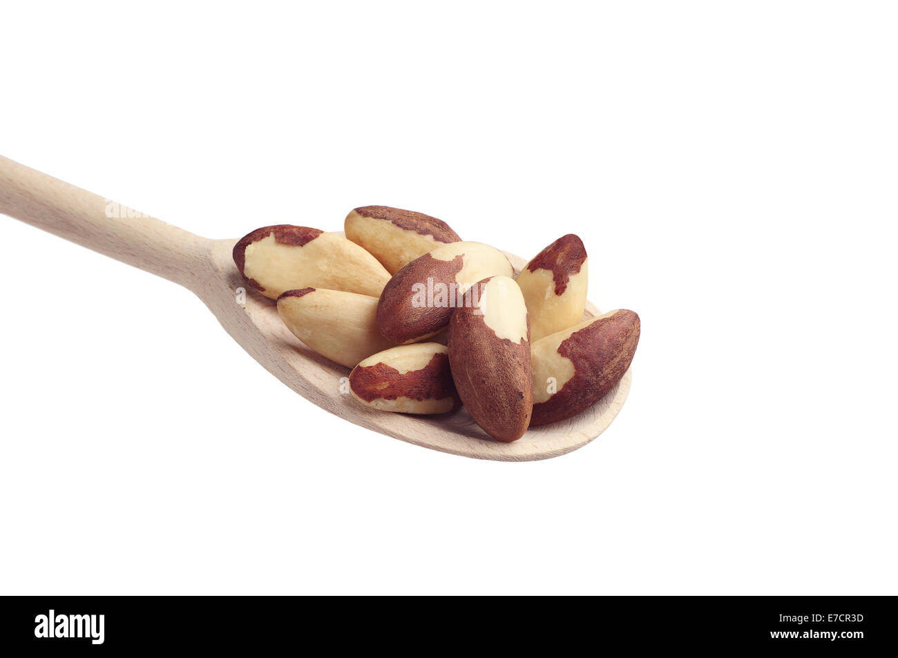 Brazil nuts in wooden spoon isolated on white background Stock Photo ...