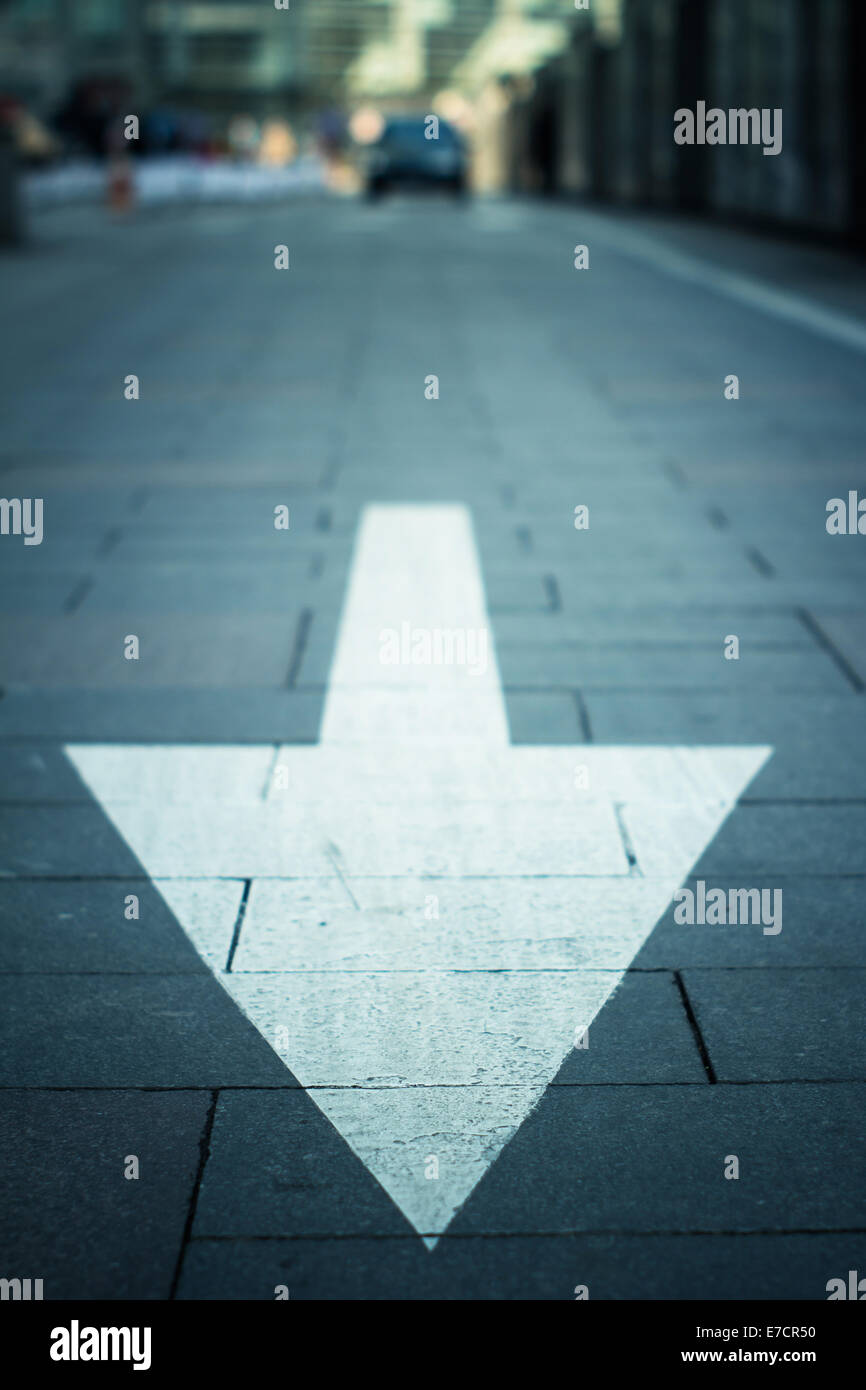 arrow on the road in city Stock Photo - Alamy