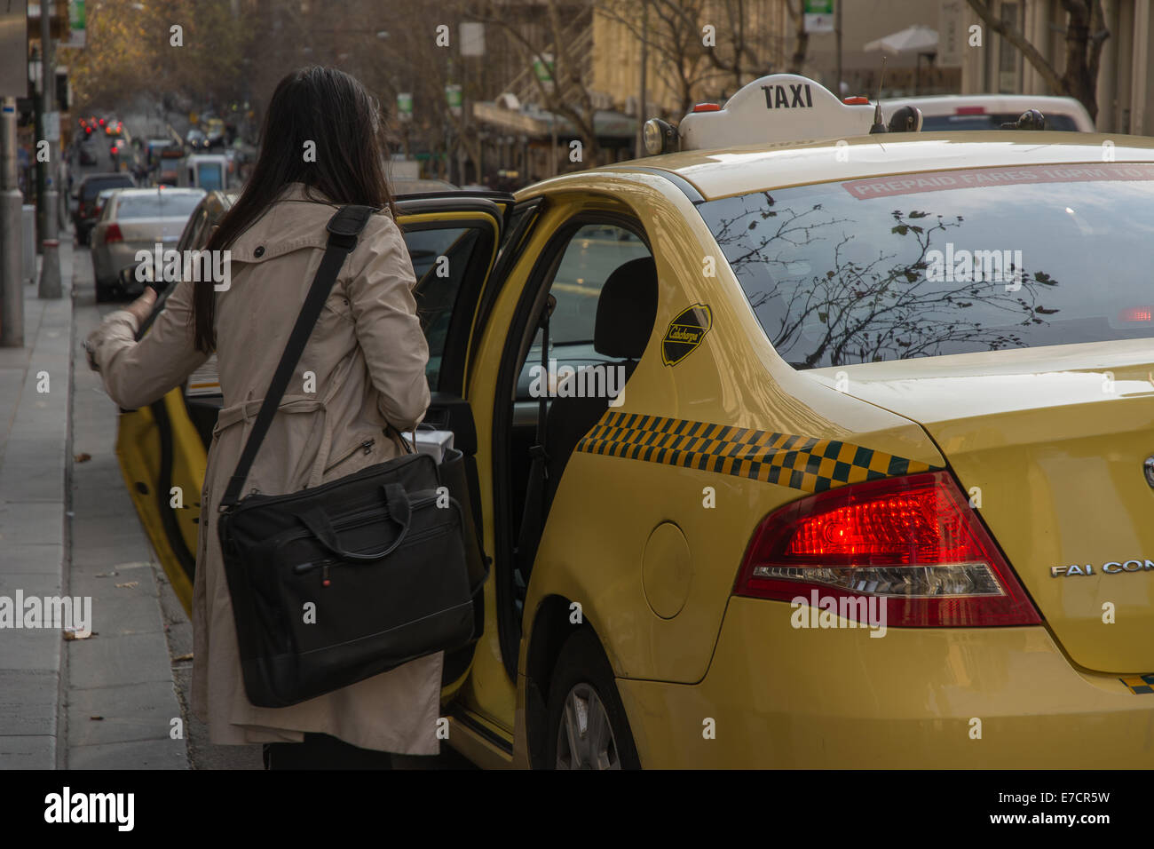 Young Woman Getting Into Taxi Cab Melbourne Australia Stock Photo - Alamy