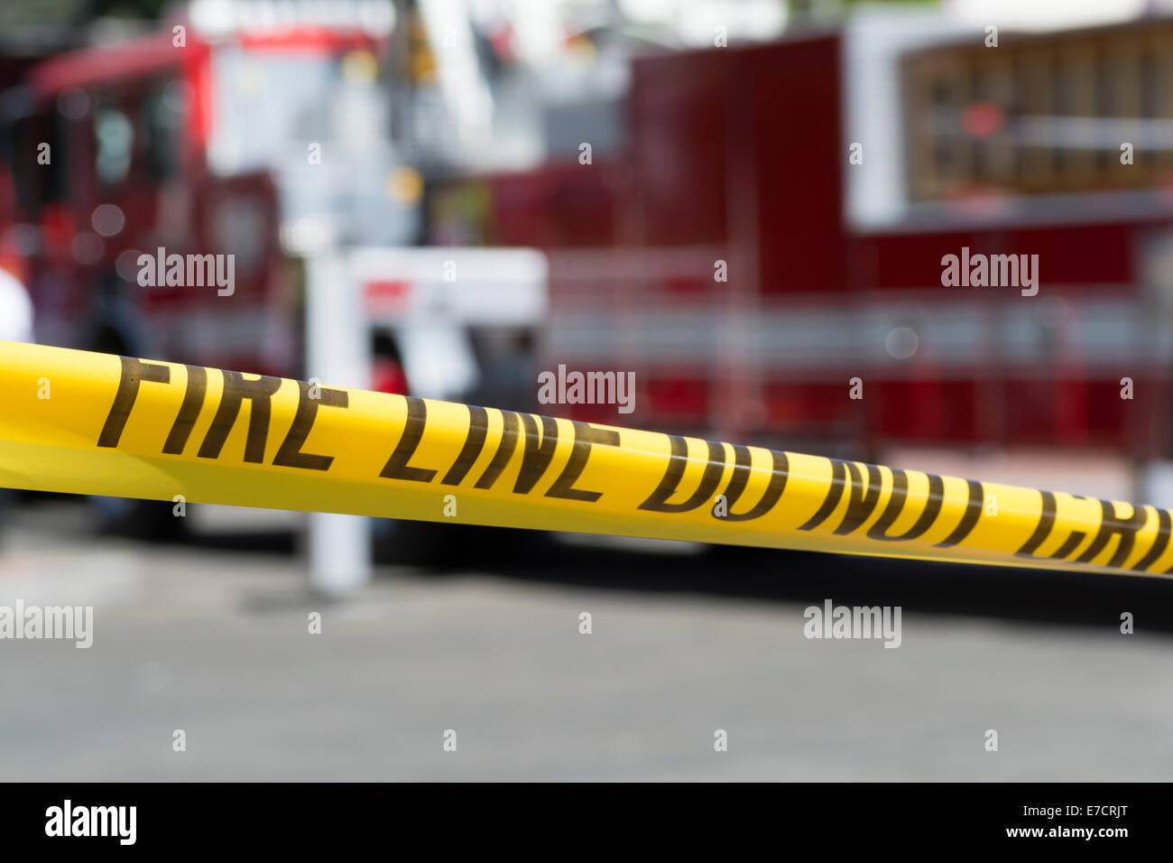 Fire line tape blocking off fire location Stock Photo - Alamy