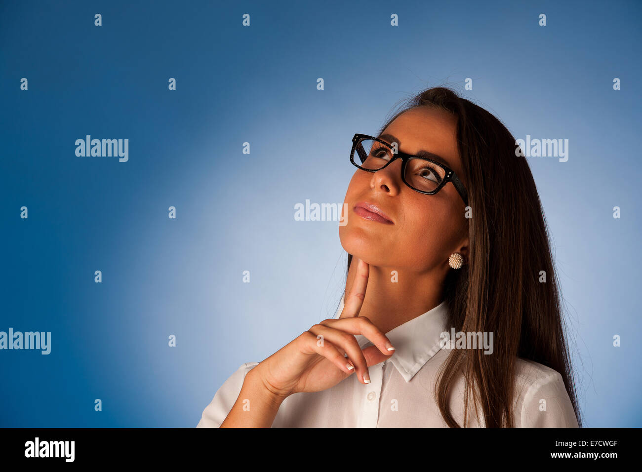 Pensive young hispanic woman thinking Stock Photo - Alamy