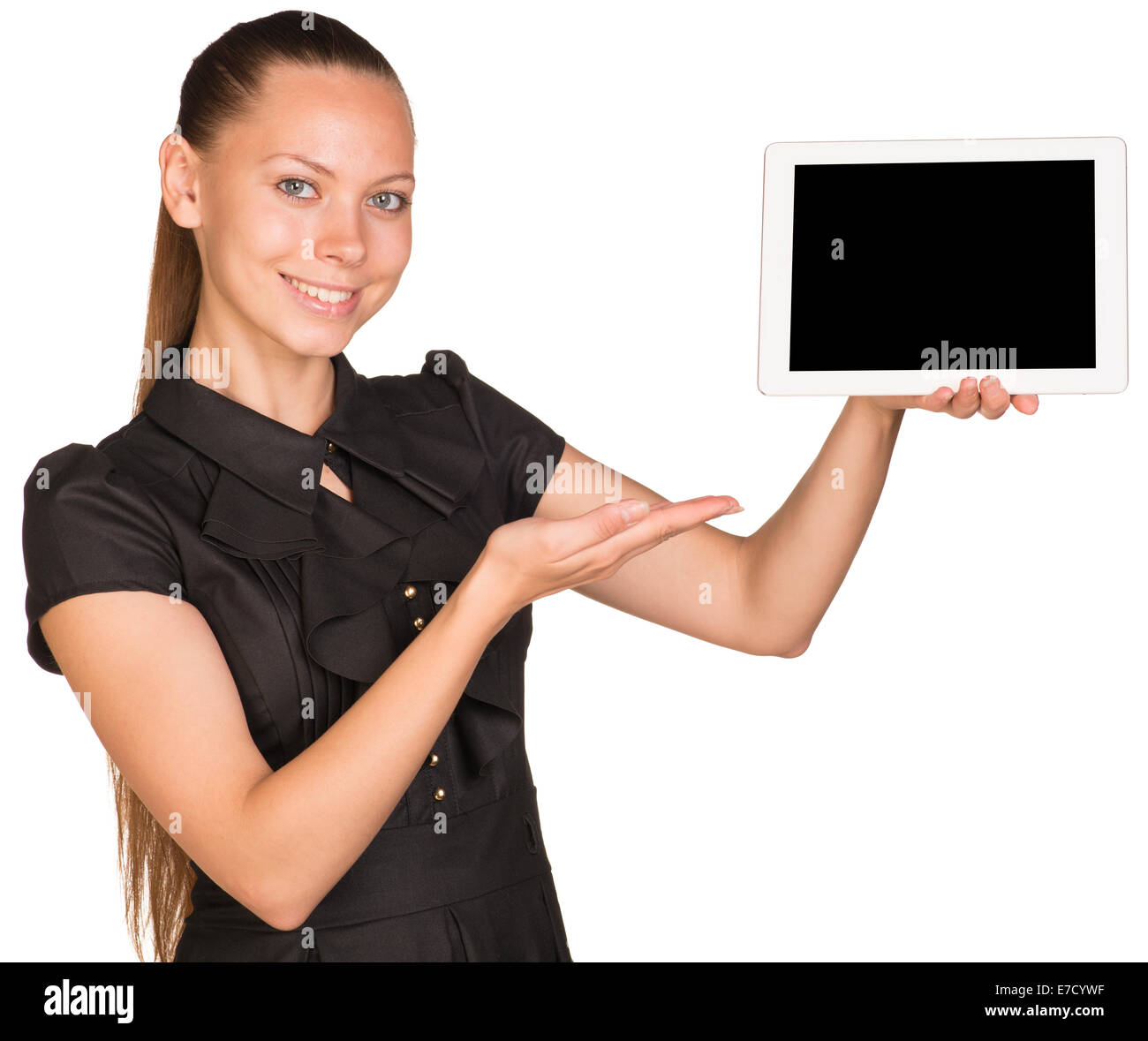 Beautiful girl in dress holding tablet and pointing at it Stock Photo ...