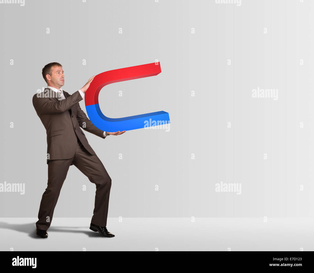 Businessman holding magnet hi-res stock photography and images - Alamy