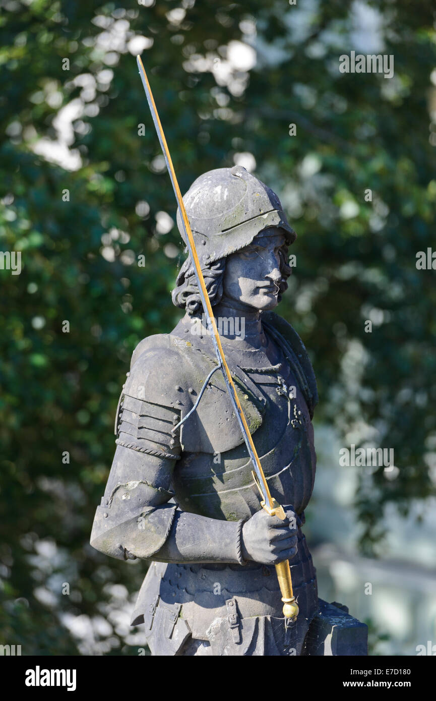 A knight holding a sword in his right hand and standing by the Charles ...