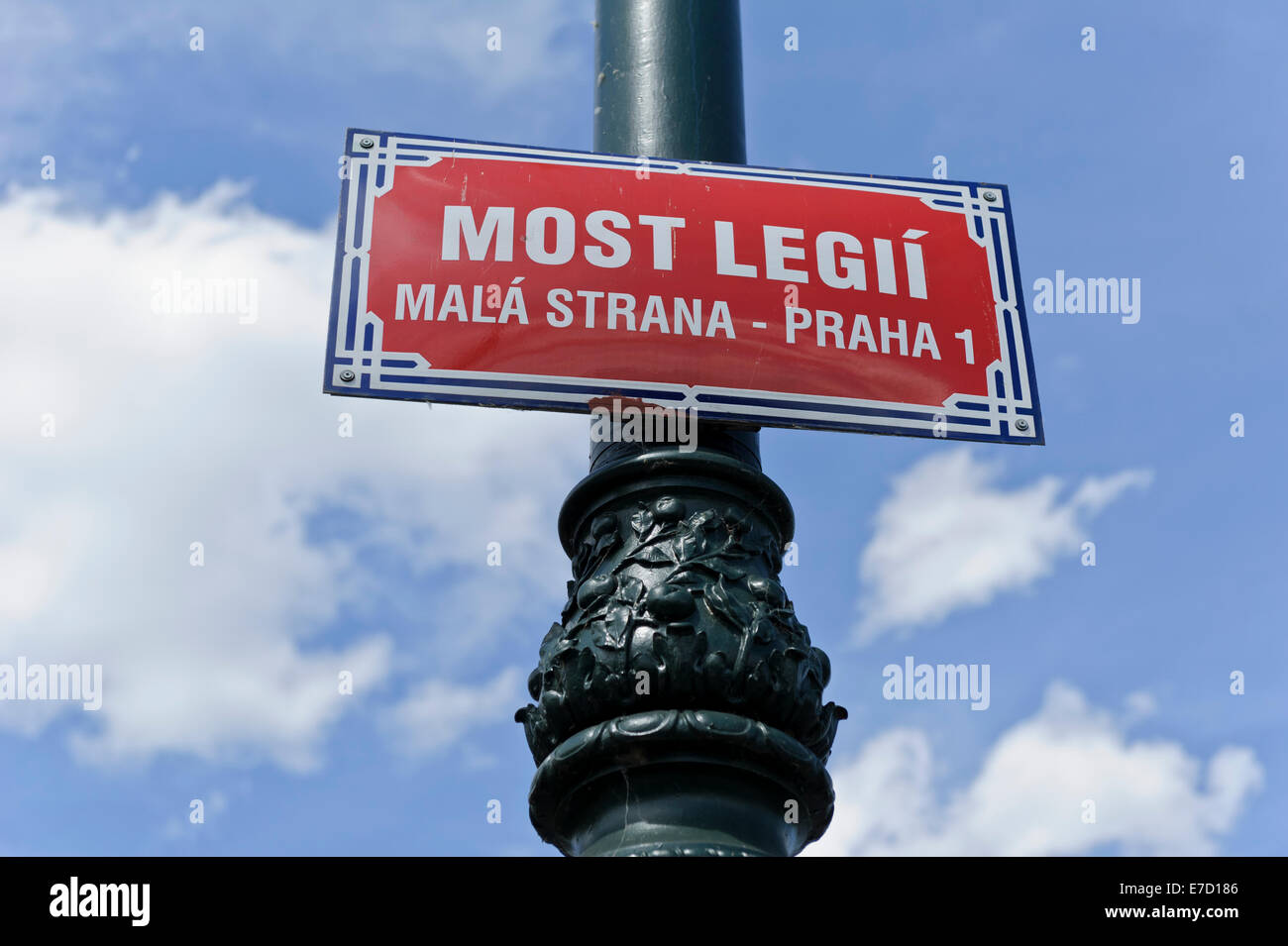 A typical street sign with white letters on red background in City of ...