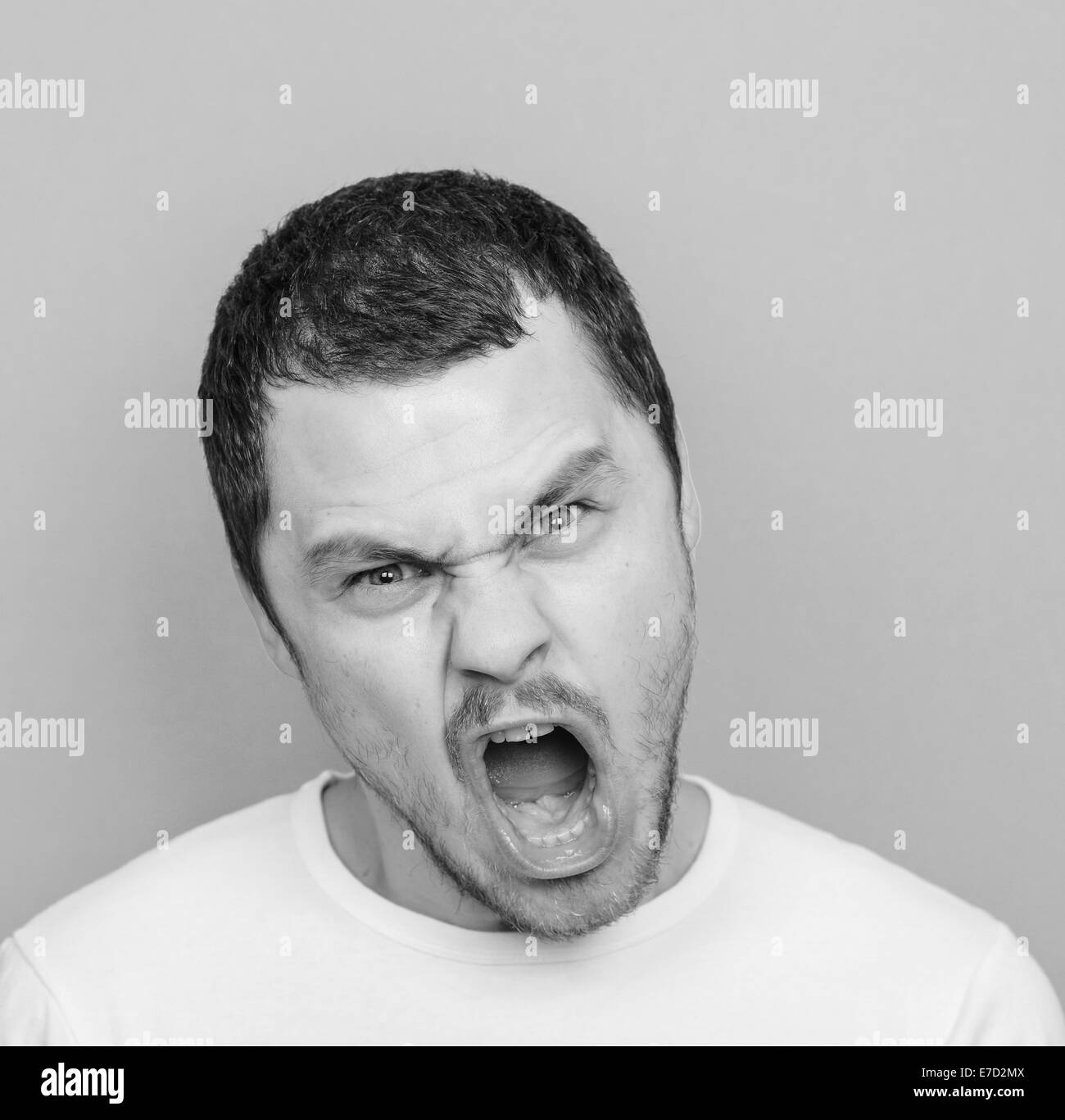 Portrait of angry man screaming - Monocrome or black and white portrait ...