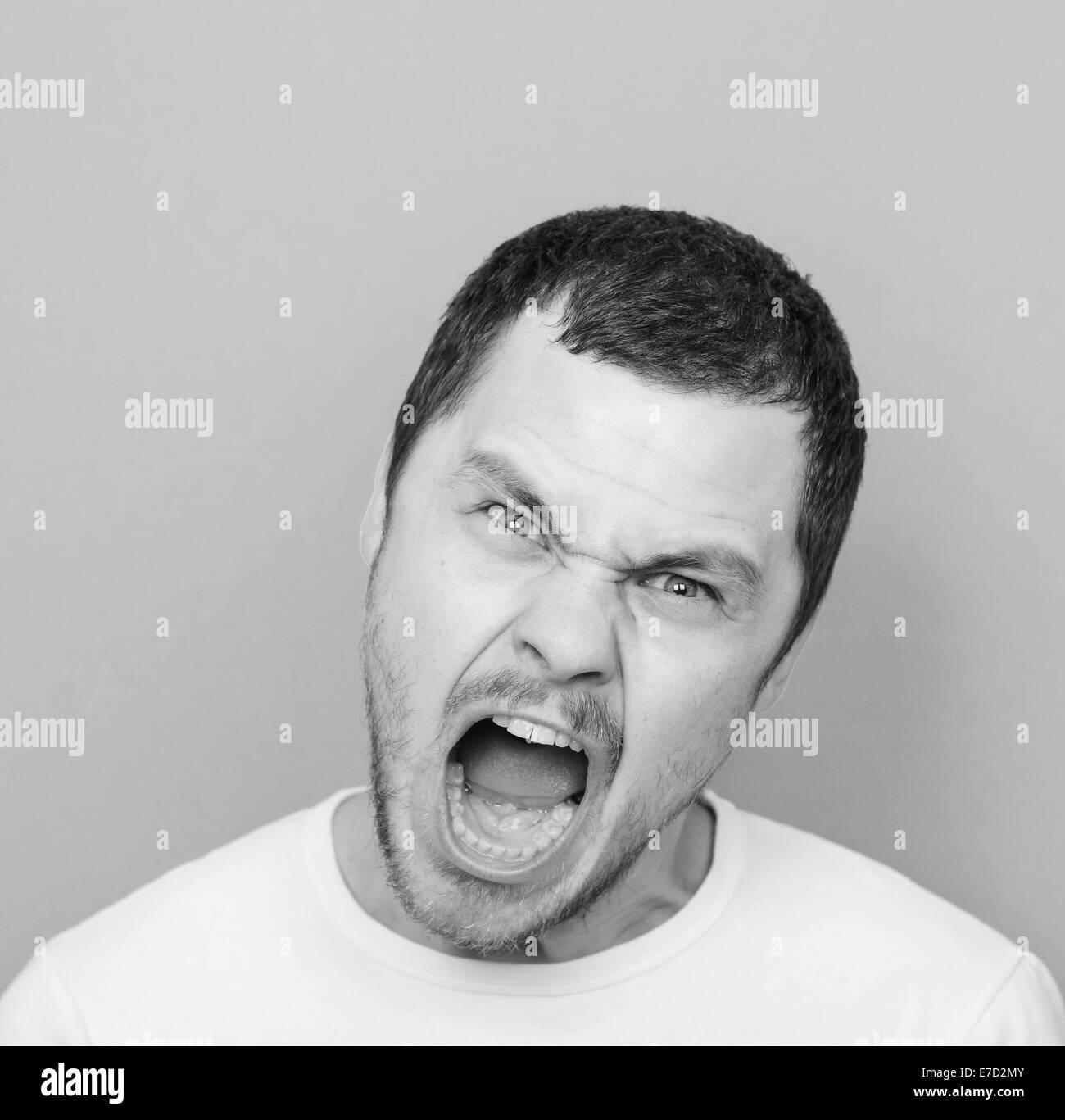 Portrait of angry man screaming - Monocrome or black and white portrait ...