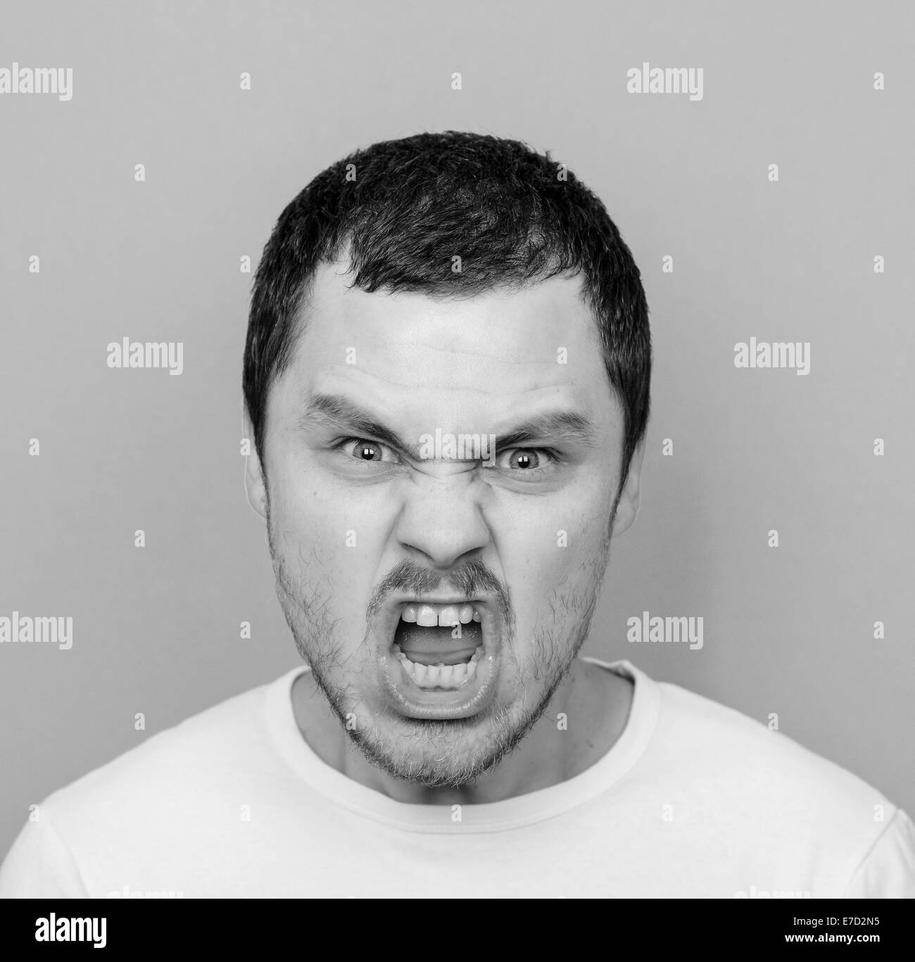 Portrait of angry man screaming - Monocrome or black and white portrait ...