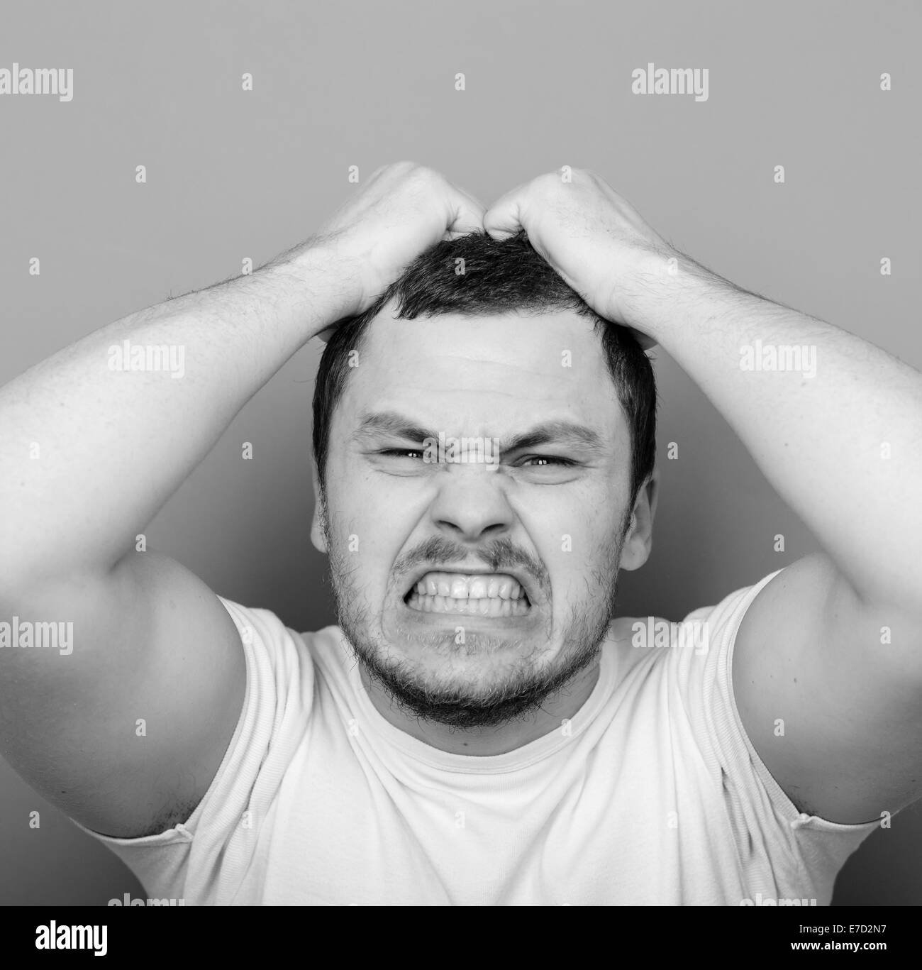 Portrait of angry man screaming and pulling hair - Monocrome or black ...