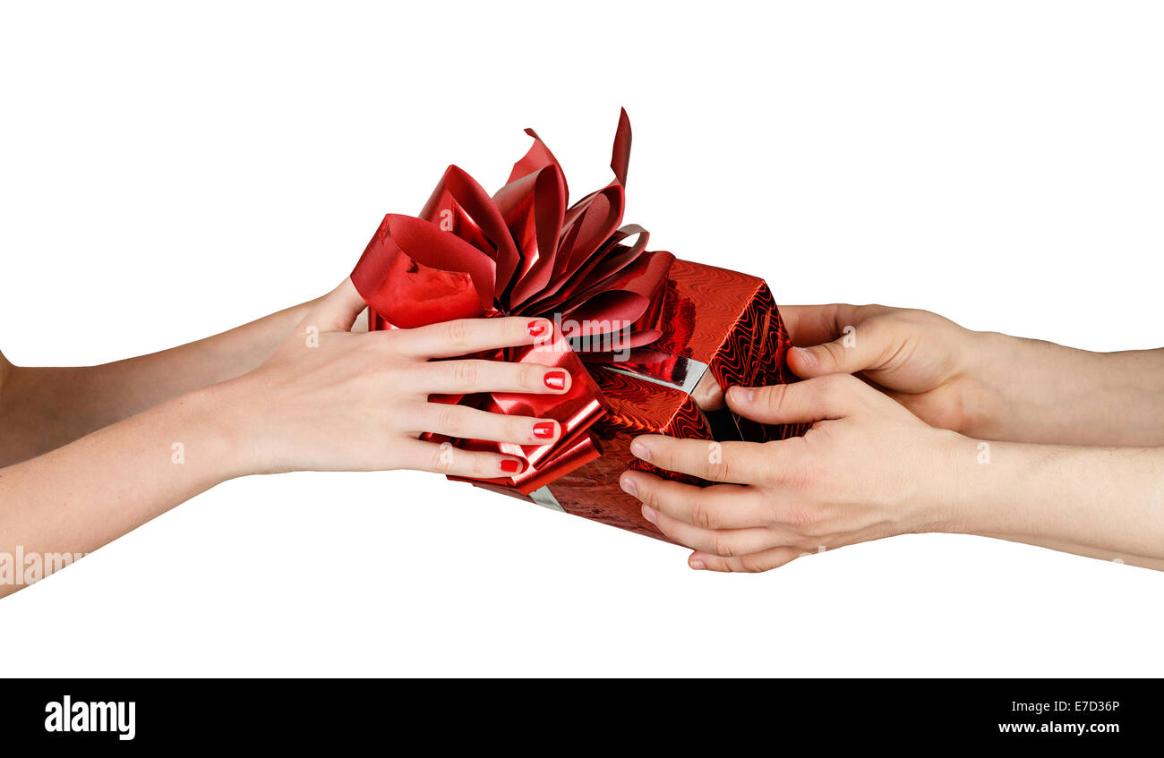 Male hands give a gift to female hands isolated on white background ...