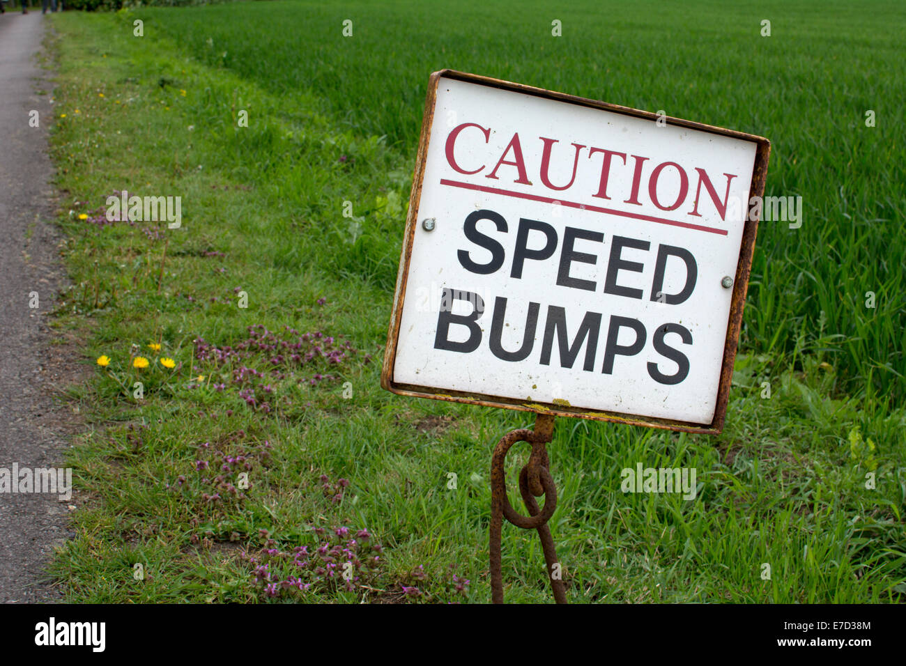 Caution speed bumps traffic sign Stock Photo - Alamy