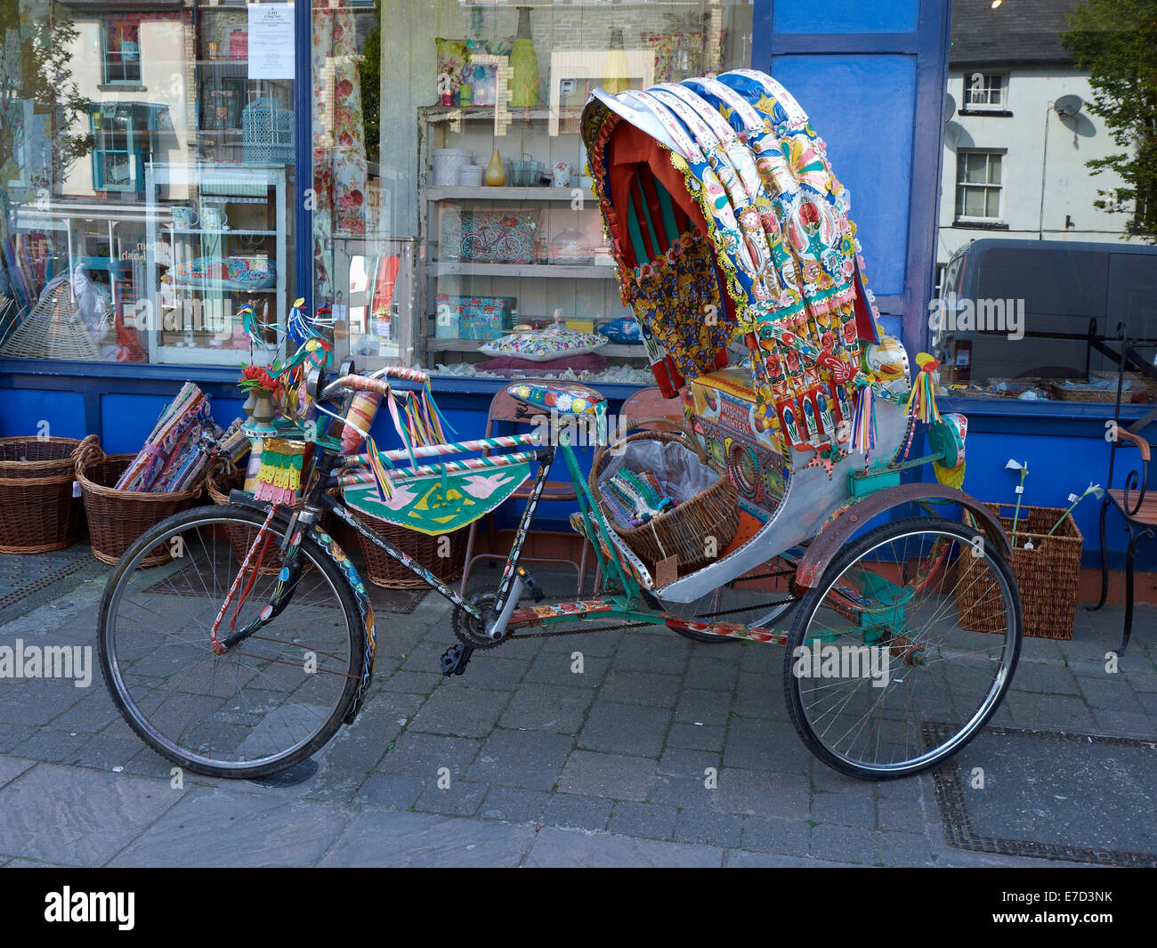 Tricycle taxi on display at antique shop in Machynlleth Wales UK Stock ...