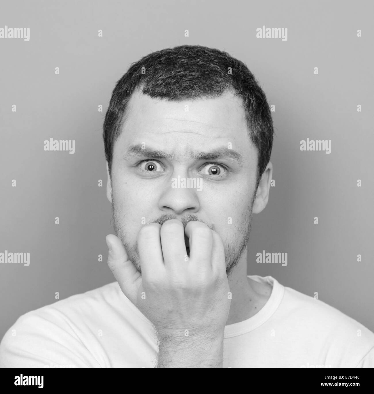 Portrait of man biting nails - Monocrome or black and white portrait ...