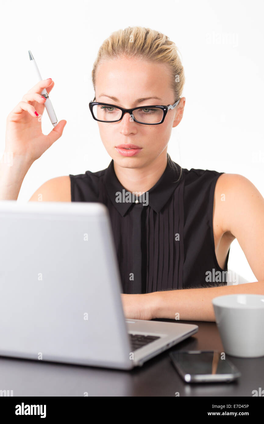 Confident businesswoman multitasking in hi-res stock photography and ...