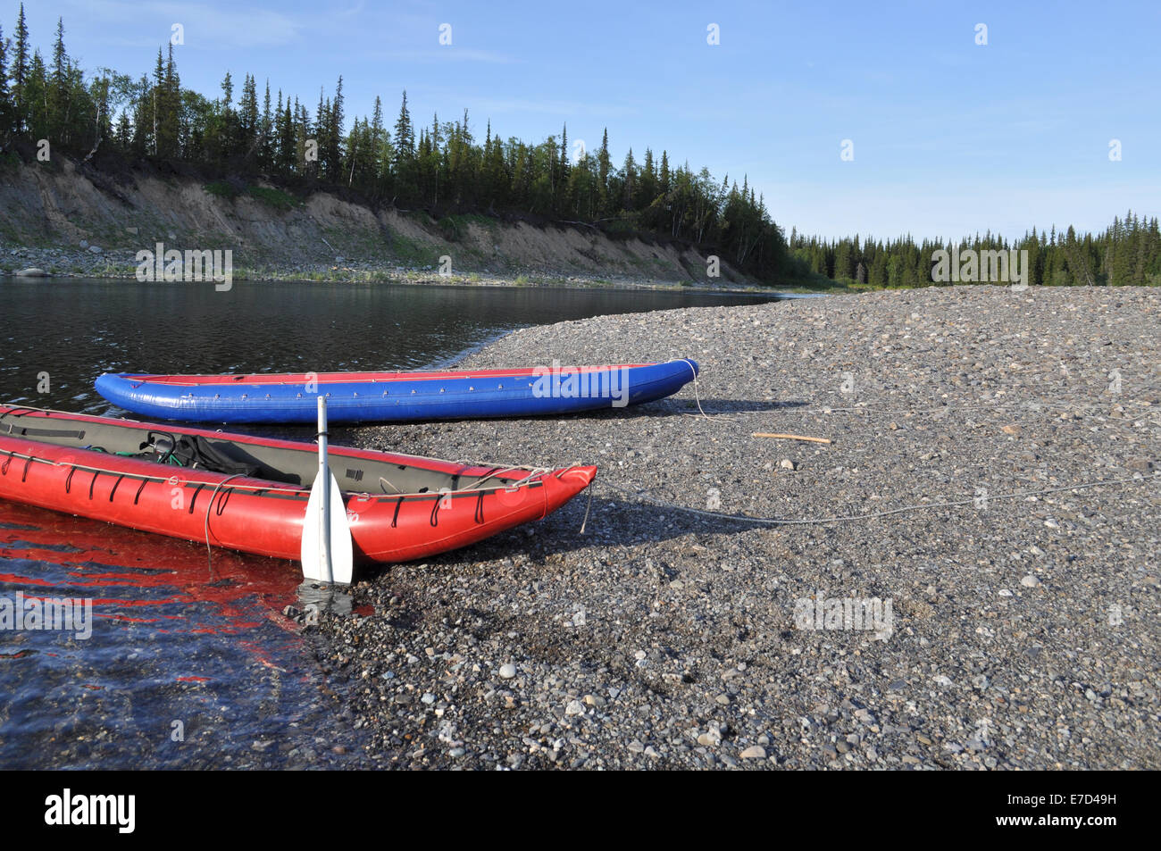 Inflatable kayaks on the shore taiga rivers. The river of the polar ...