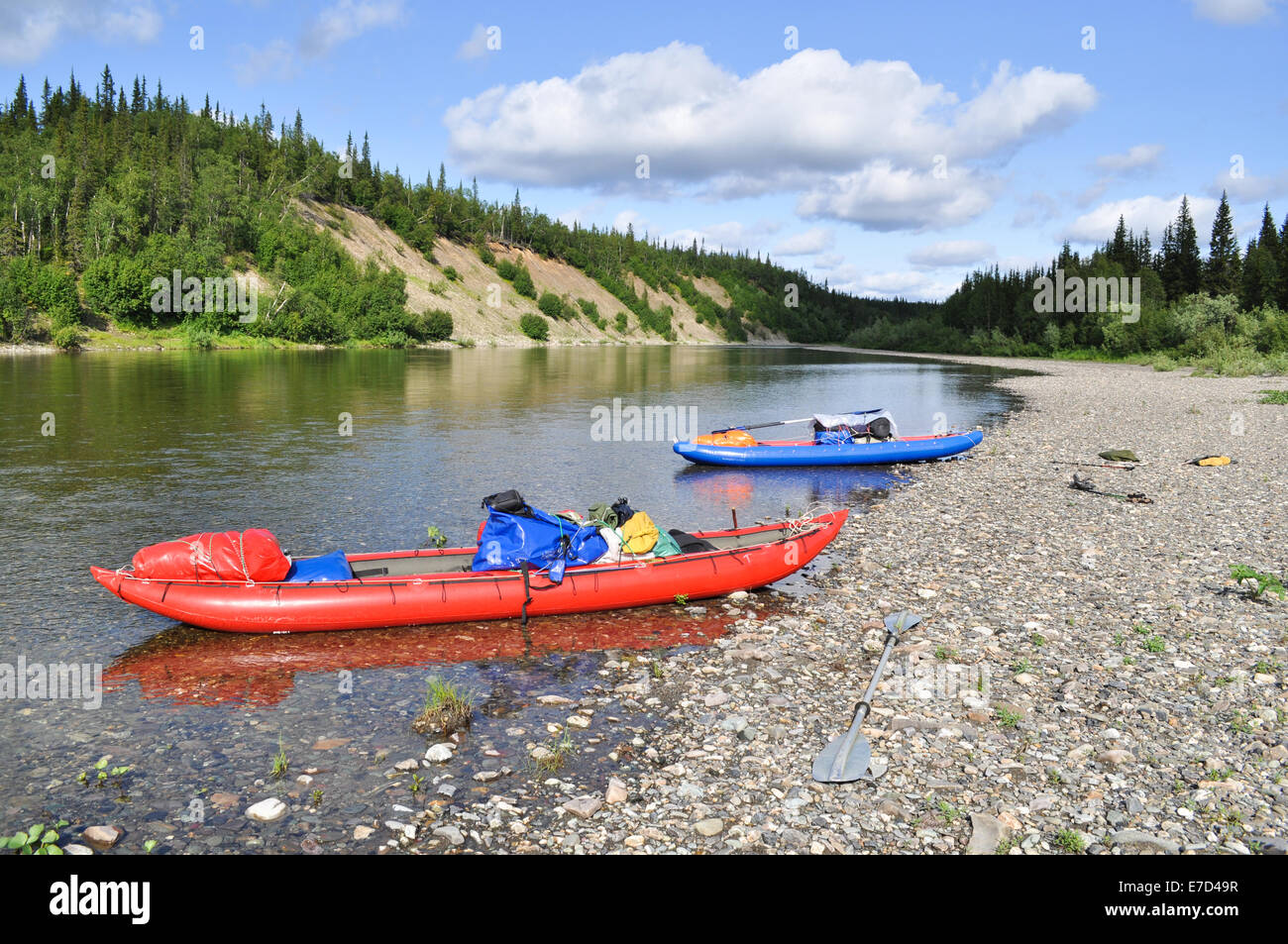 Inflatable kayaks on the shore taiga rivers. The river of the polar ...