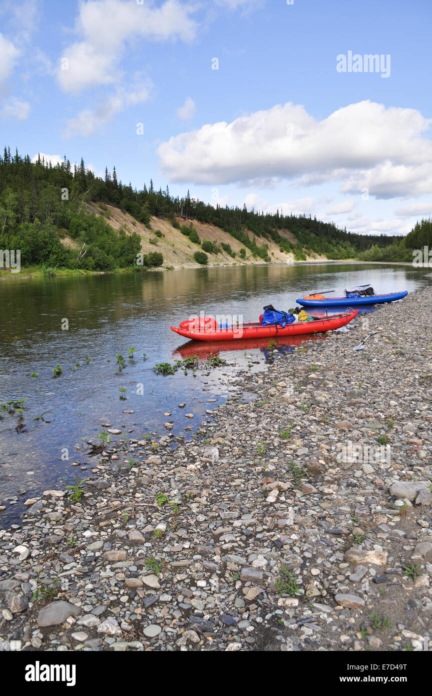 Inflatable kayaks on the shore taiga rivers. The river of the polar ...