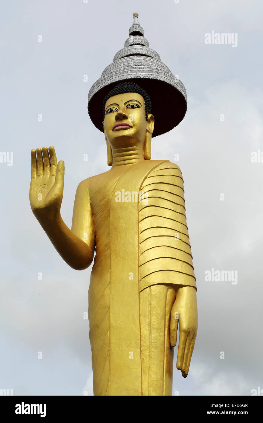 Golden Buddha statue at Wat Dey Dos, Kampong Cham ,Cambodia. The temple ...