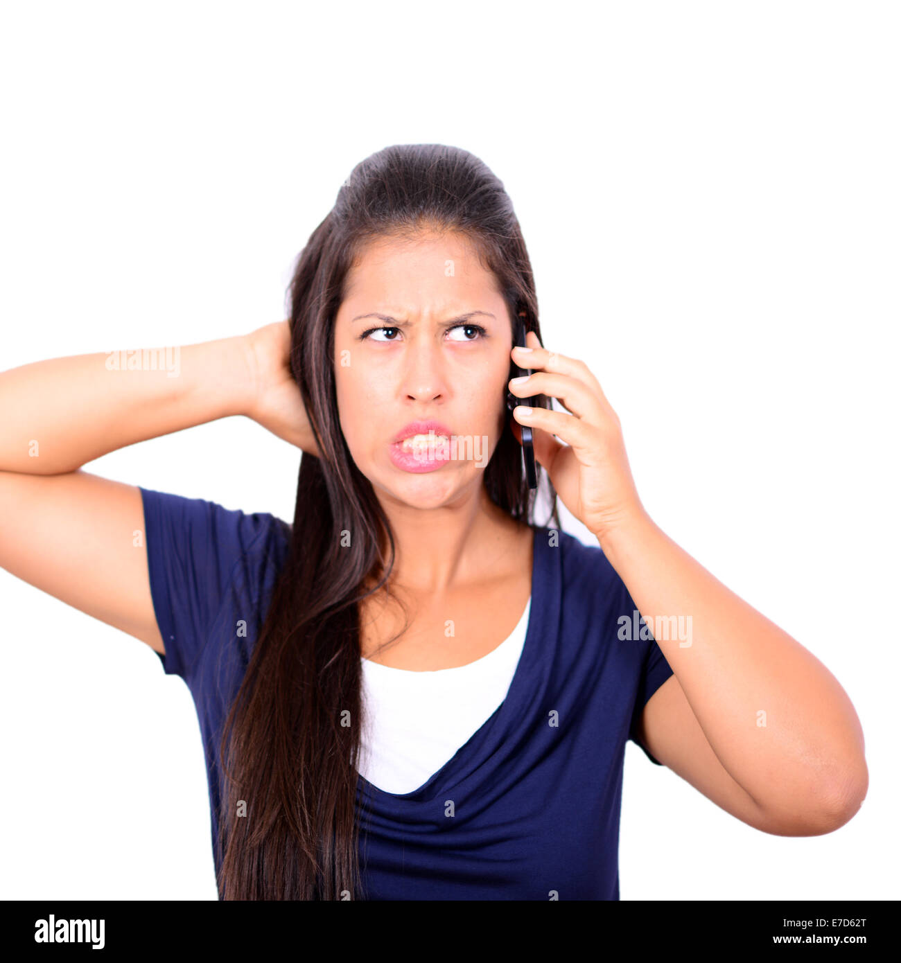 Angry young businessman shouting on the mobile phone while isolated on ...