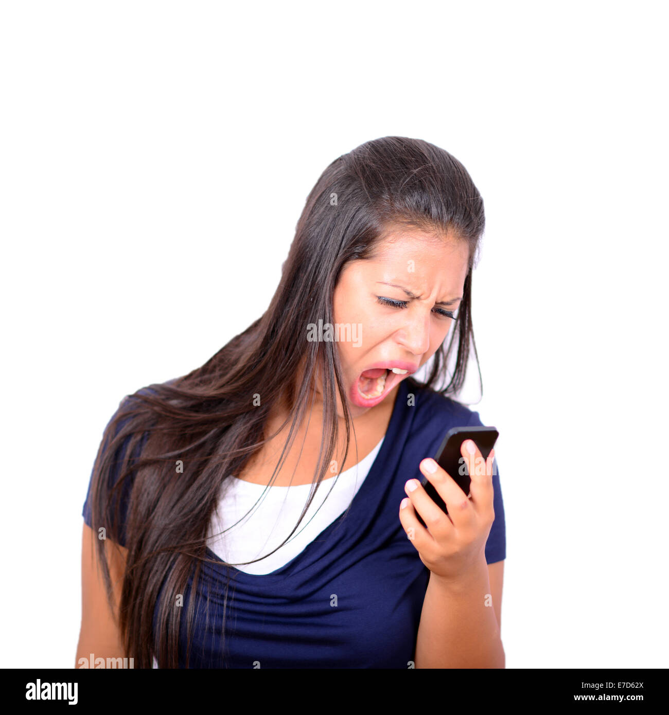 Angry young businessman shouting on the mobile phone while isolated on ...