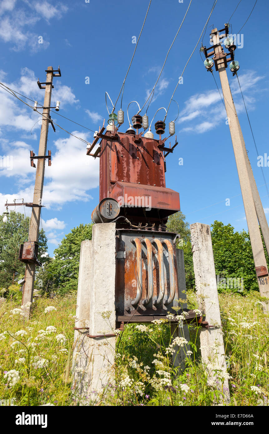 Power transformer against the blue sky background Stock Photo - Alamy