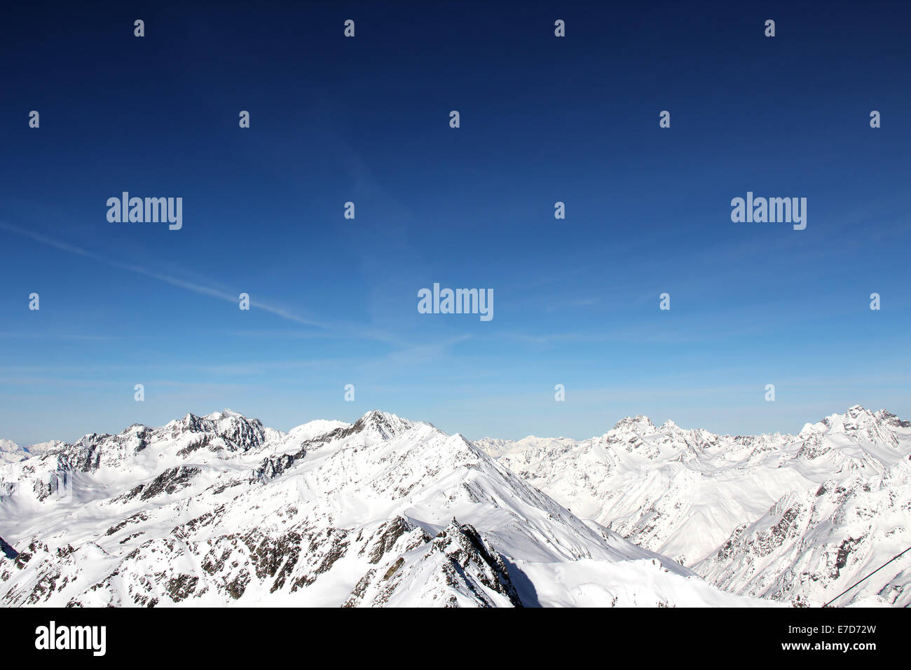 Tops of winter alp mountains at sunny day Stock Photo - Alamy