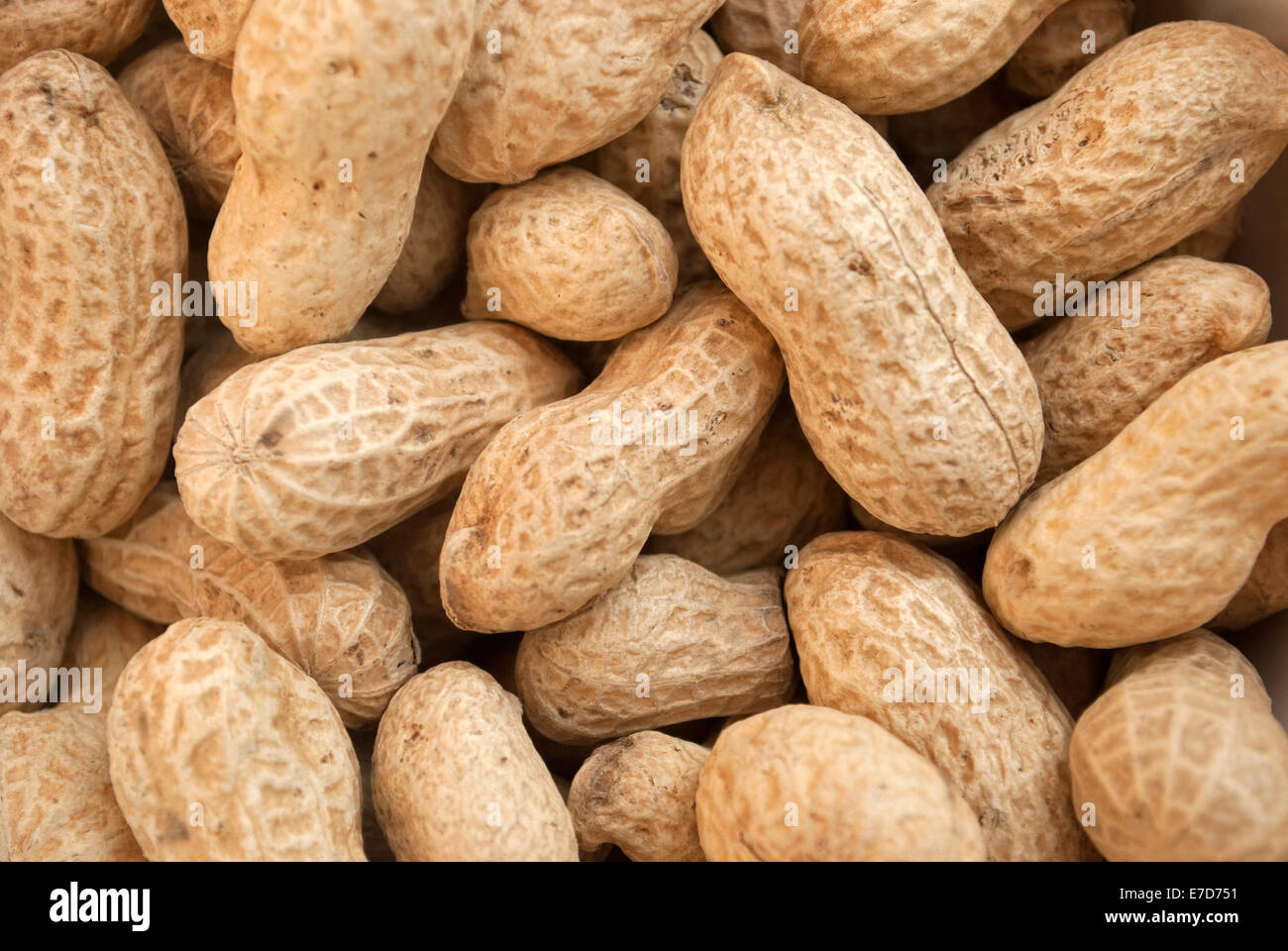 Peanuts in their shell textured food background Stock Photo - Alamy