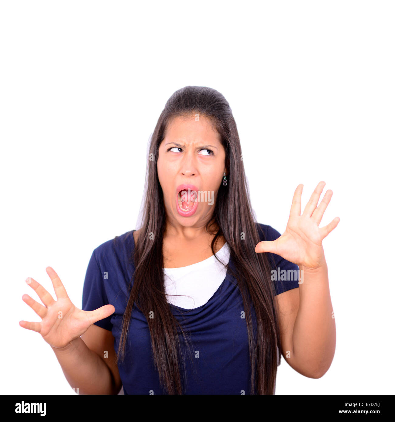 Scared woman with spread hands against white background Stock Photo - Alamy