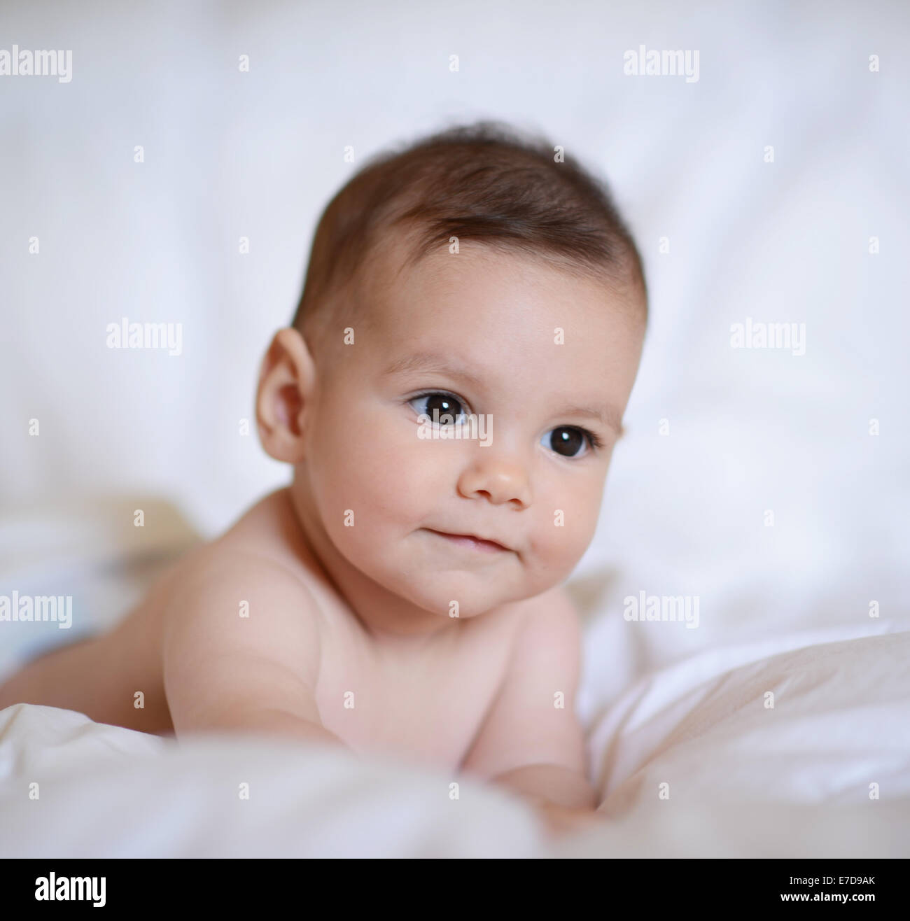 Beautiful baby girl looking at camera Stock Photo - Alamy