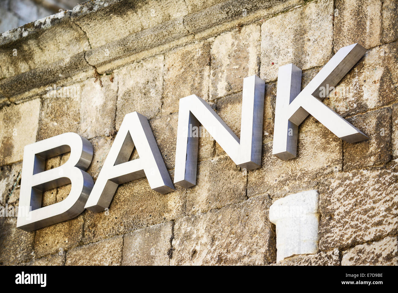 Bank sign carved in stone on building Stock Photo - Alamy