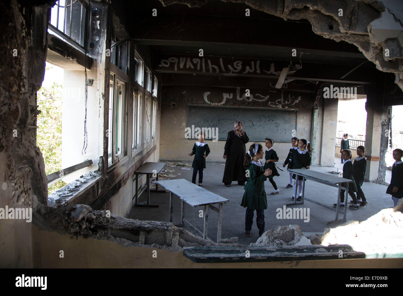 Gaza. 14th Sep, 2014. Palestinian students study inside their damaged ...