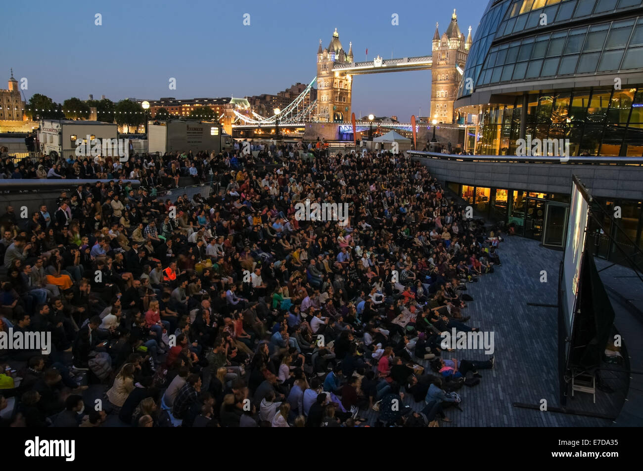 Free open air cinema at The Scoop amphitheatre at dusk, London England ...