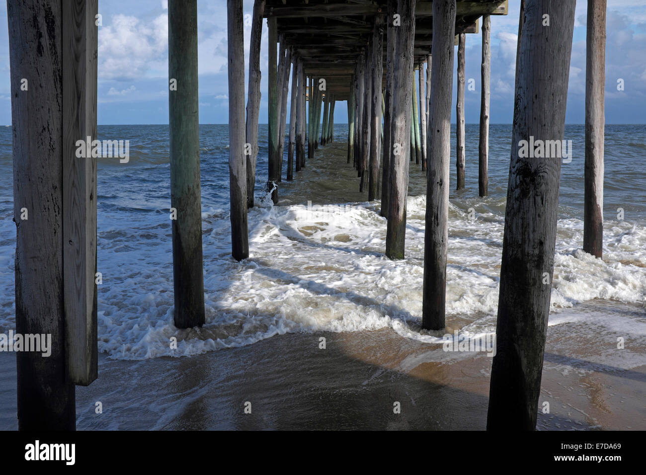 Waves under pier Stock Photo - Alamy