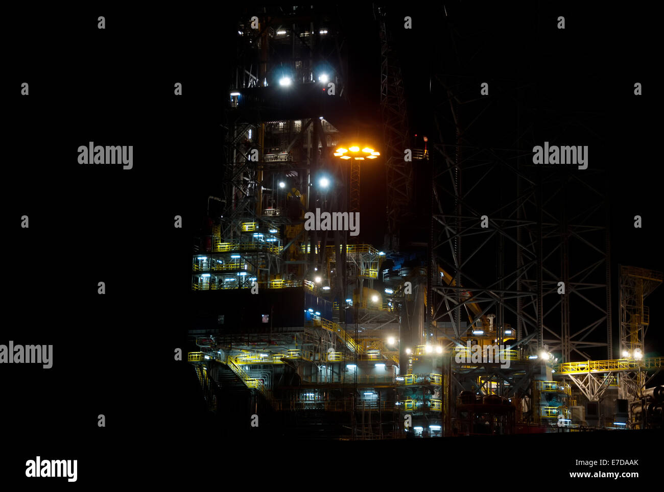 Oil rig at night Stock Photo - Alamy