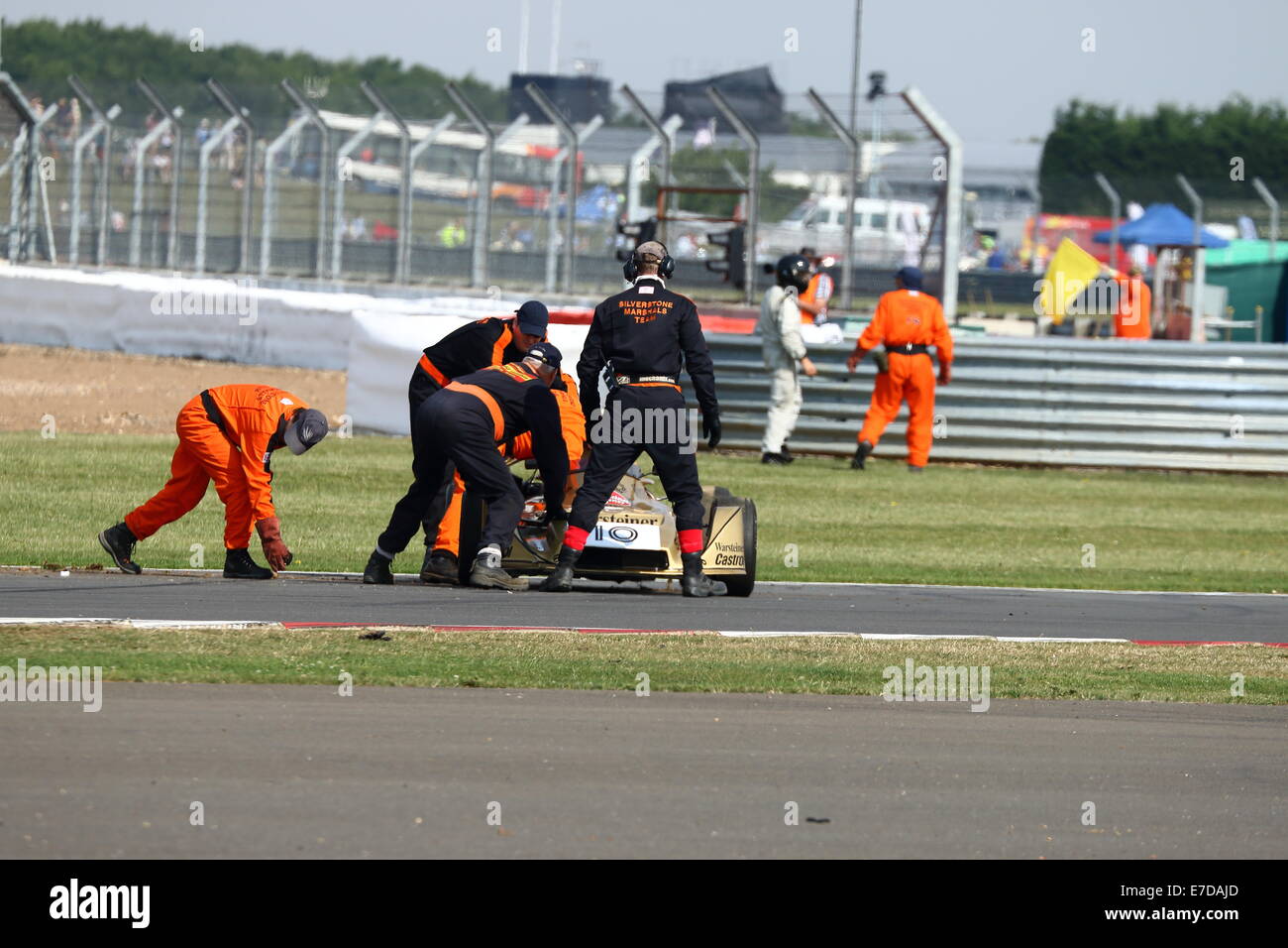 A classic Formula 3 car crashes and rolls over during a race for ...