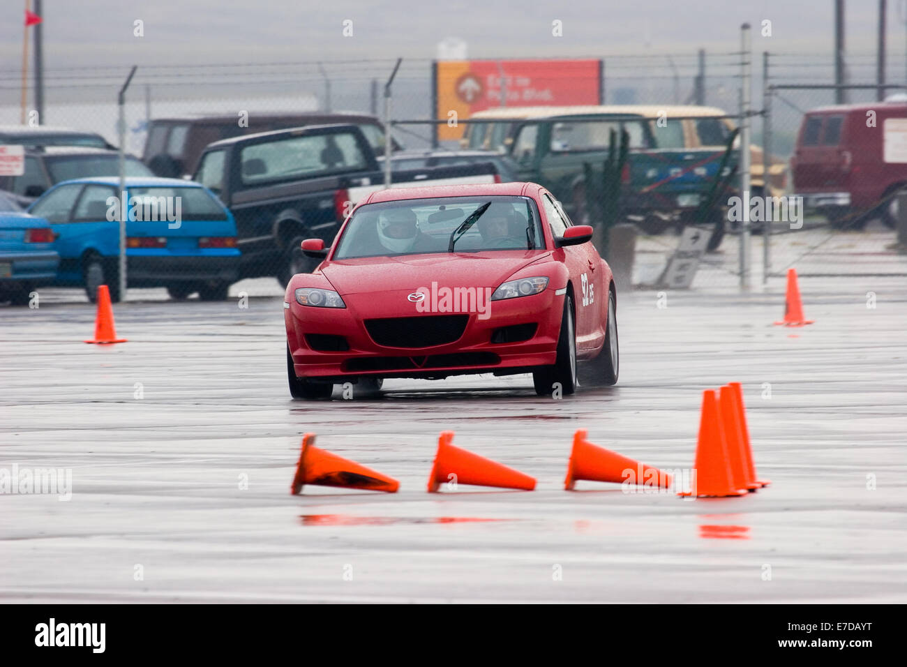 A 2004 Red Mazda RX-8 in an autocross race at a regional Sports Car ...