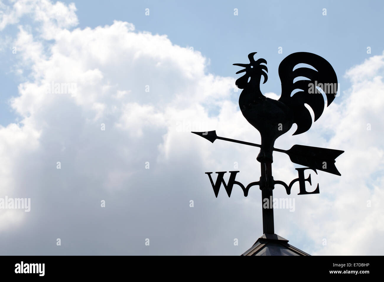 silhouette of weathercock on roof over blue sky Stock Photo - Alamy