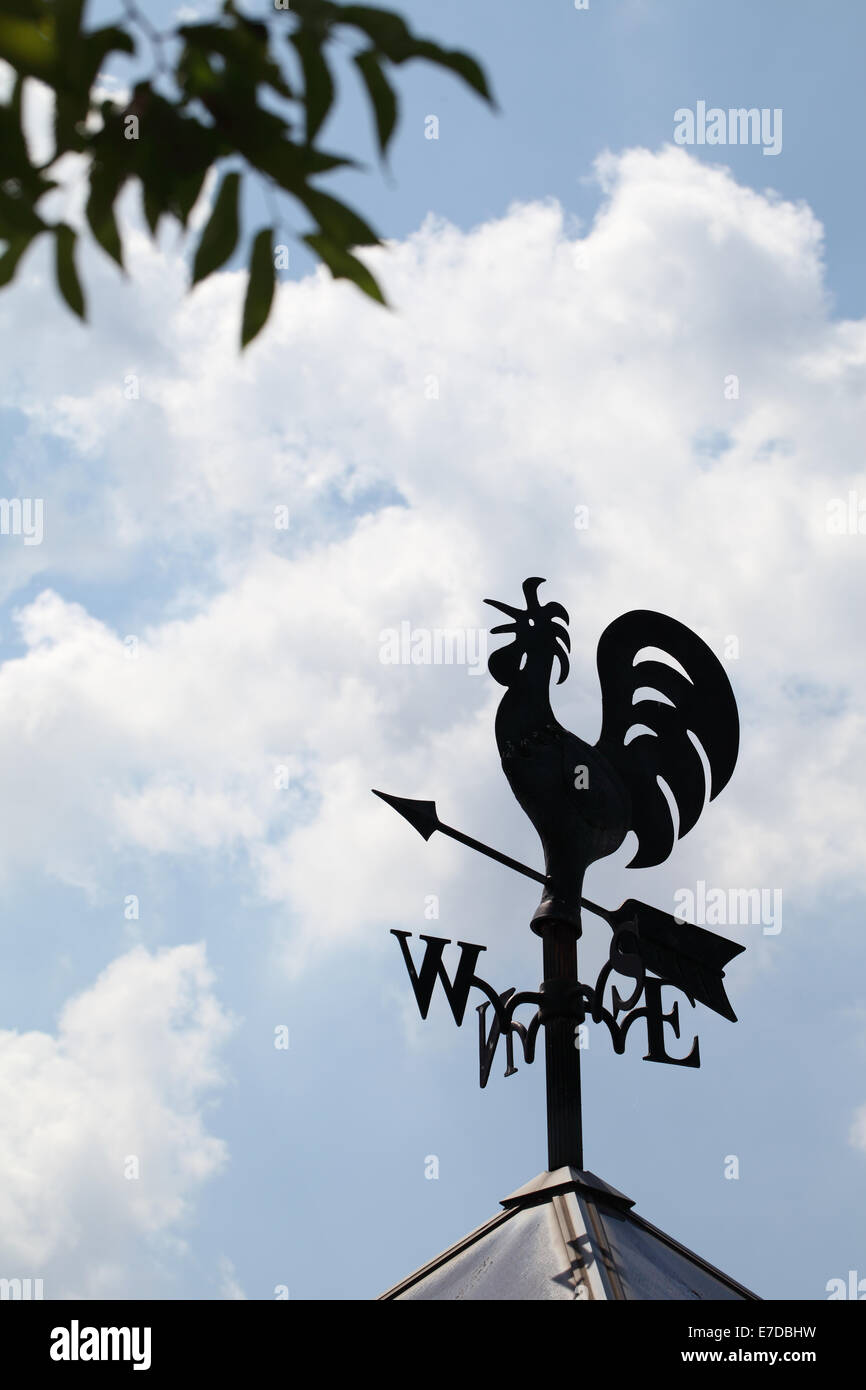 silhouette of weathercock on roof over blue sky Stock Photo - Alamy