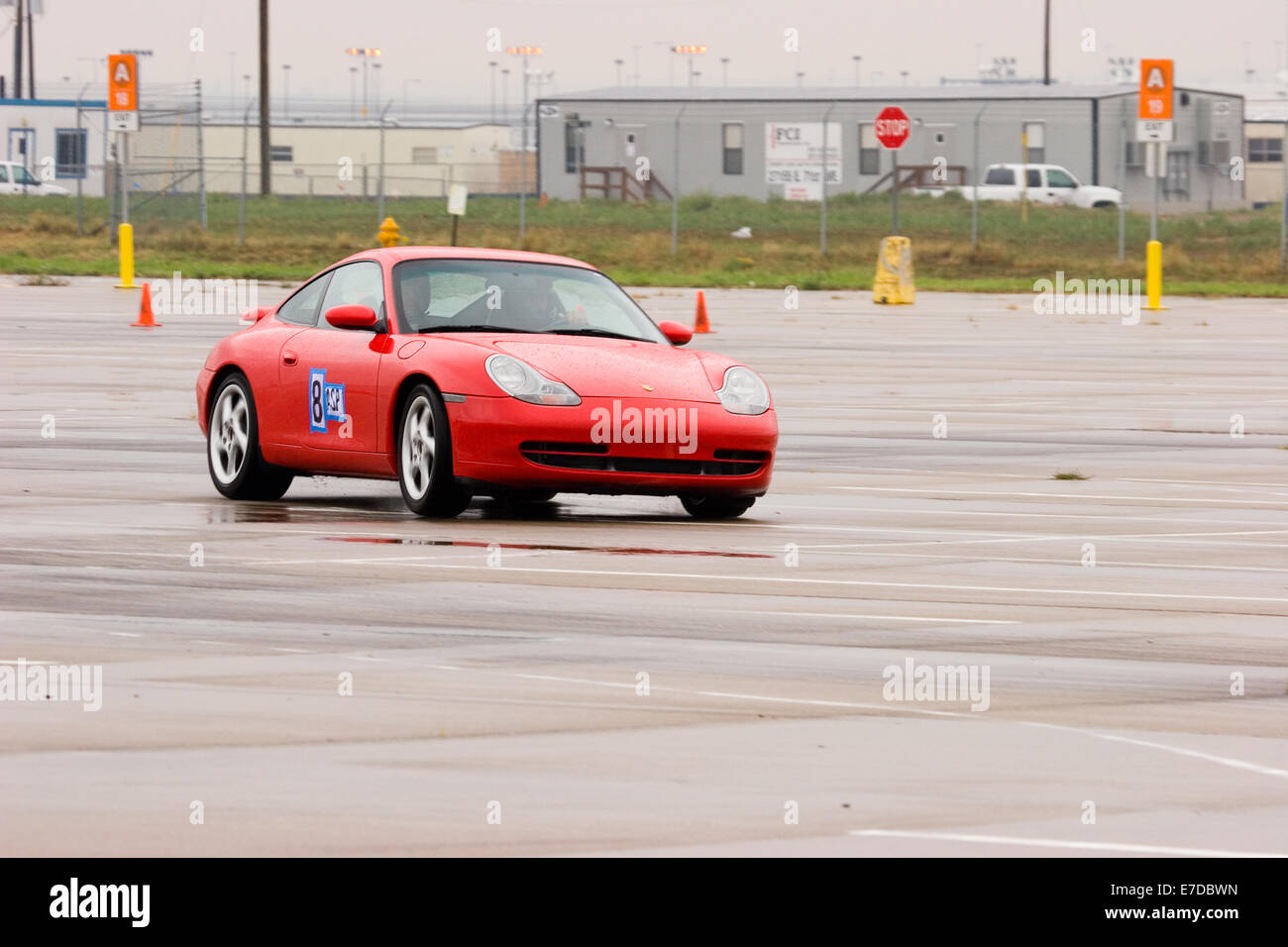 A 1999 Red Porsche 996 C2 in an autocross race at a regional Sports Car ...