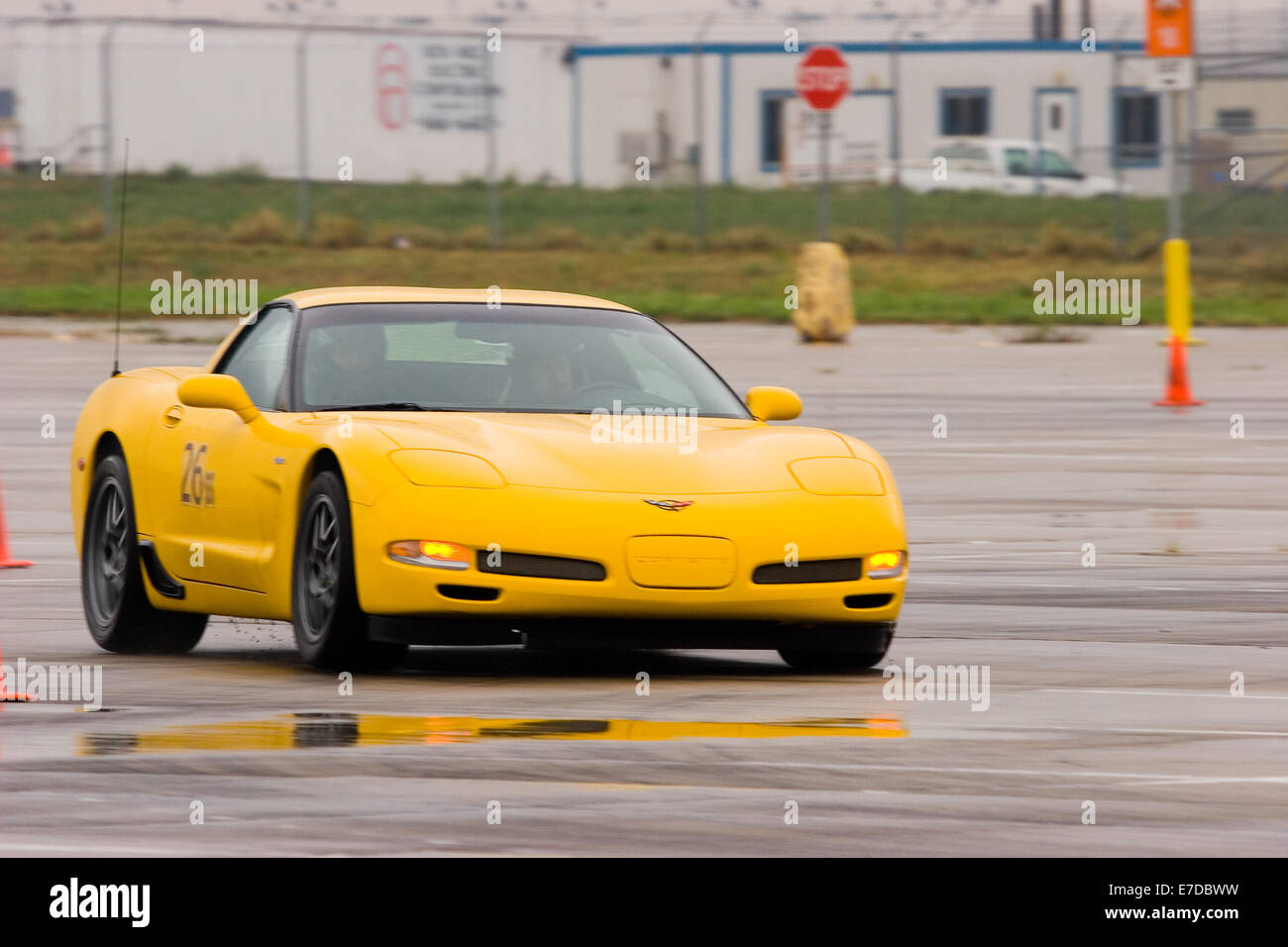 A 2001 Yellow Chevrolet Corvette Z06 in an autocross race at a regional ...