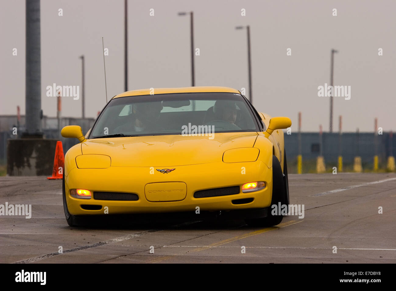 A 2001 Yellow Chevrolet Corvette Z06 in an autocross race at a regional ...