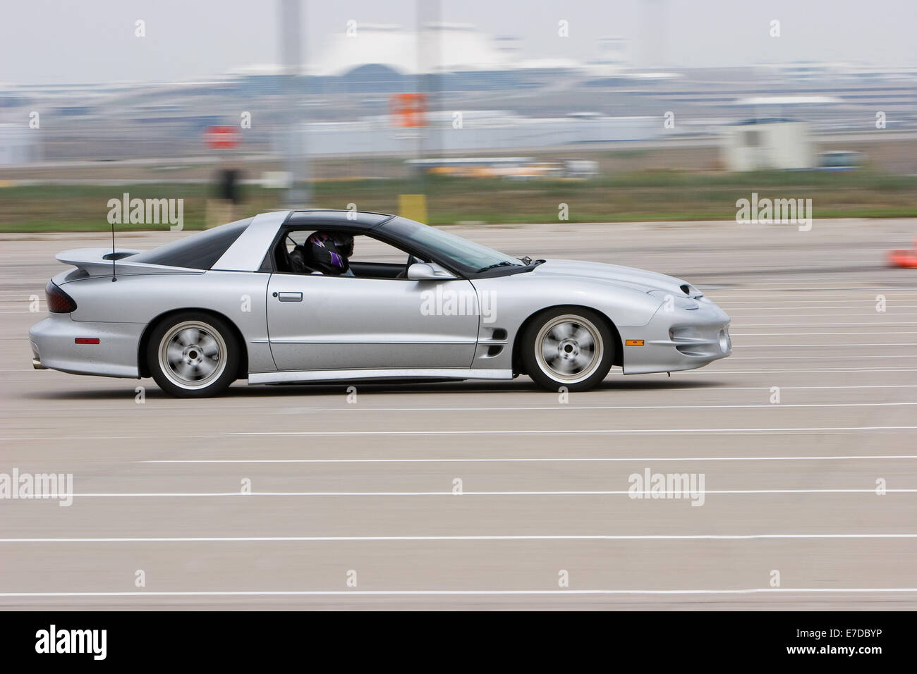 A fast gray sports car in an autocross race at a regional Sports Car ...